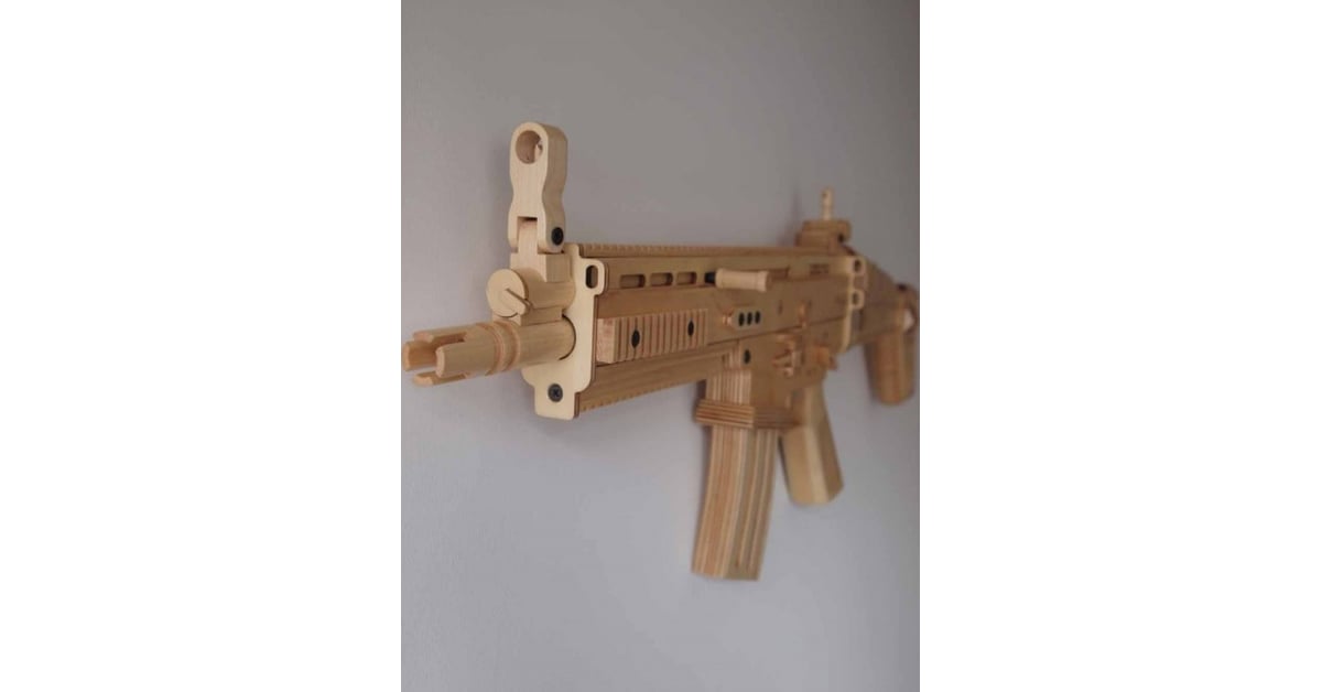 FN Herstal buys wooden FN SCAR replica from UK artist