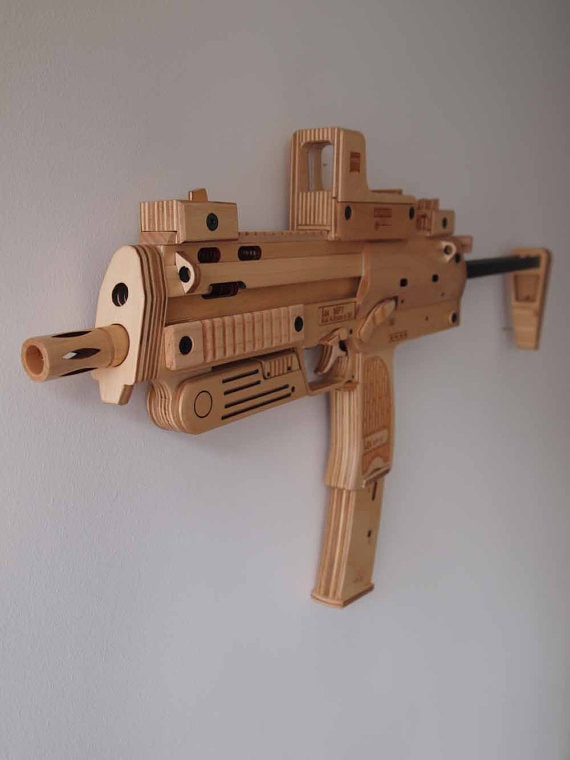 FN Herstal buys wooden FN SCAR replica from UK artist